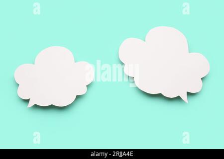 Blank speech bubbles on turquoise background Stock Photo - Alamy