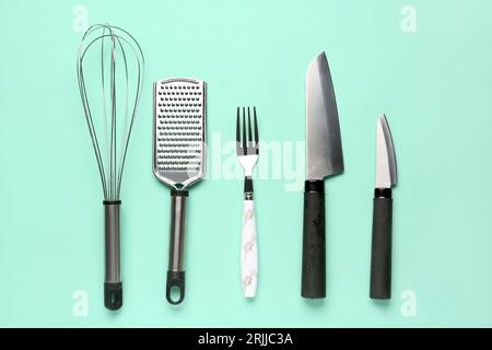 Set of kitchen utensils on turquoise background Stock Photo - Alamy