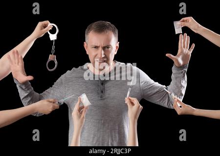 Mature junkie rejecting drugs on black background Stock Photo - Alamy