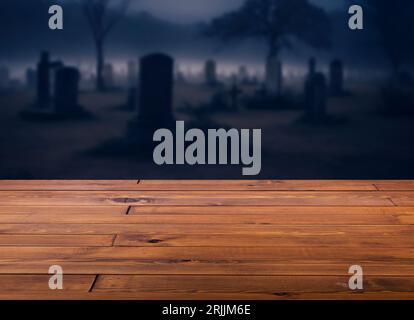 Empty wooden table and creepy forest at night. Halloween celebration ...
