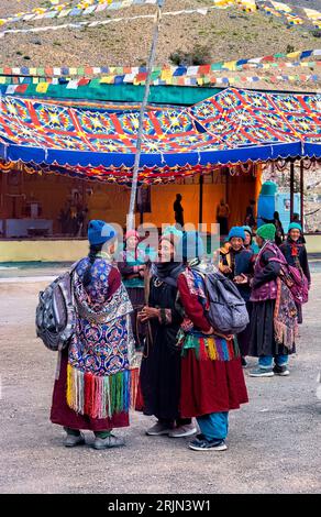 Ladakhi women in traditional clothing (perak headdress) at a high lama ...