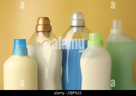 Bottles of fabric softener on yellow background, space for text Stock ...