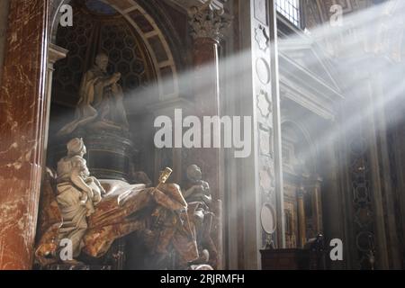 The sunlight illuminates the tomb of Alexander VII in St. Peter's ...