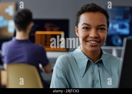 Young happy professional in office Stock Photo - Alamy