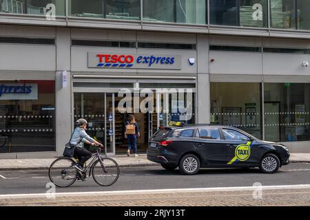 People shopping in the Tesco supermarket superstore, Aberystwyth Wales ...