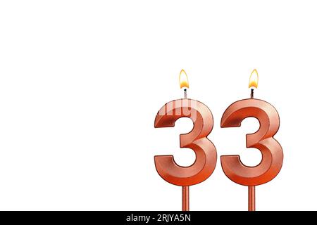 Birthday candle number 33 on white background Stock Photo - Alamy