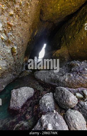 Exploring the breccia rock formations of Point of Arches at low tide ...