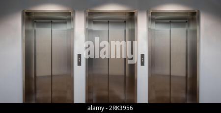 Elevators lobby, Stainless steel lifts with closed doors front view ...