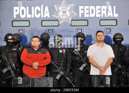 Teodoro Garcia Simental, known as "El Teo," center, is guarded by ...