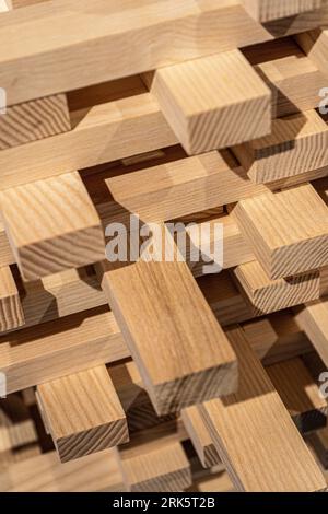 Wooden background. Big constructor from cut wooden blocks. Tower wall ...