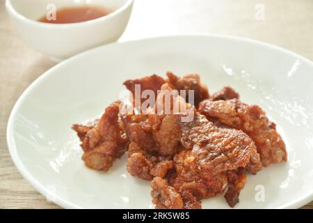 fried salty beef meat and belly arranging on plate dipping chili sauce ...