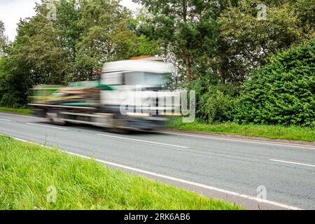 Speeding lorry on motorway UK Stock Photo - Alamy