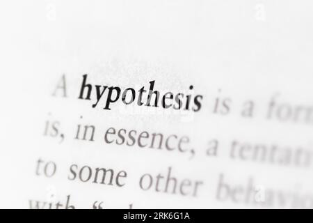 A close-up of a business textbook with the term 'improving quality ...