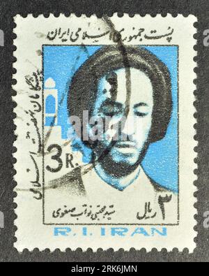 Cancelled postage stamp printed by Iran, that shows Woman With Gun ...