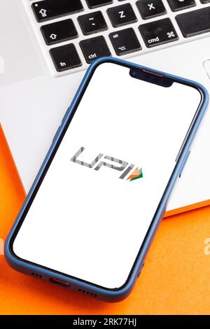 A modern smartphone displaying the UPI logo, a payment system used in ...