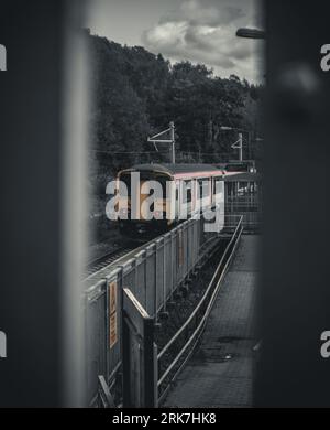 View of the station platform with a departing train. At the Pakhtakor ...