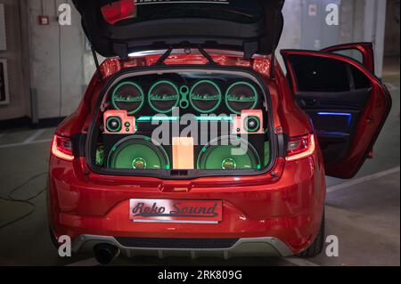 Stunning red car trunk full of speakers and subwoofers Stock Photo - Alamy