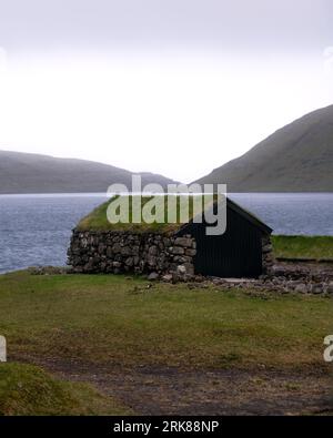 Scenic view of traditional grass roofed houses in Mykines, Faroe ...