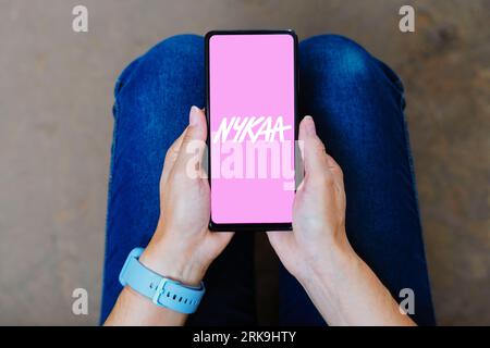 In this photo illustration, the Nykaa logo is seen displayed on a ...