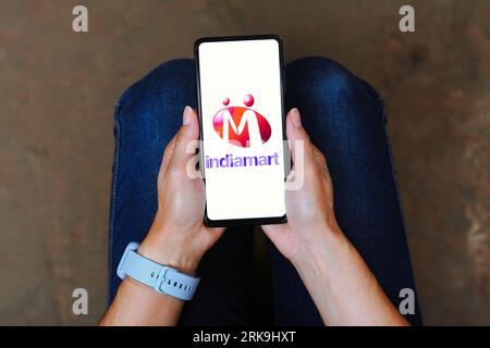 In this photo illustration, the IndiaMART logo seen displayed on a ...