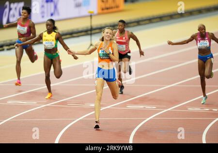 Femke Bol of the Netherlands, left, celebrates with teammates after ...