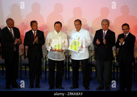 Philippine Foreign Secretary Alberto Romulo, left, speaks during the ...