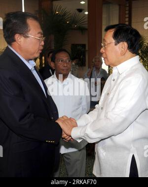 Philippine Foreign Affairs Secretary Alberto Romulo, right, welcomes ...