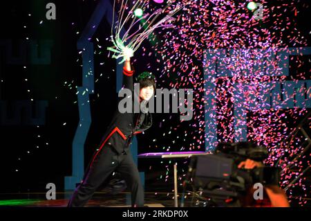 Young Boy Magician Performing Magic Trick Stock Photo - Alamy