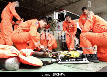 Members of the Subic Bay Metropolitan Authority hold the Philippine ...