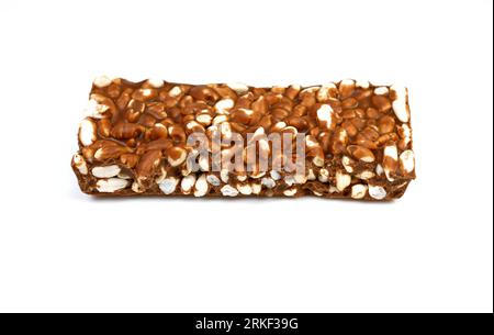 Chunks of milk chocolate with puffed rice isolated on white background ...