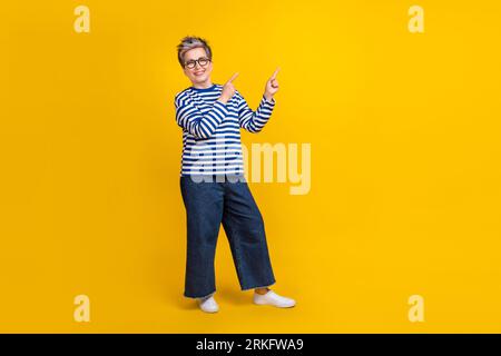 Photo of satisfied girl hand arm demonstrate hello hi greetings symbol ...