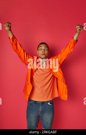 Portrait of young overjoyed delighted man see huge bargain discounts on ...