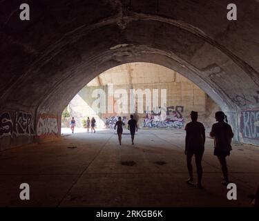Tour group explore an old secret underground bunker used by Yugoslav ...