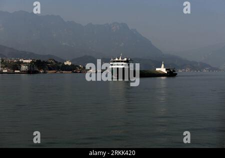 A cargo ship sails in the Xiling Gorge of the Three Gorges of the ...