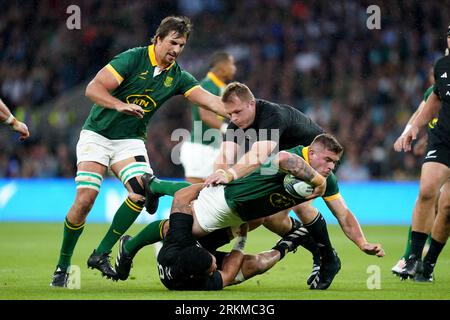 South Africa's Malcolm Marx (centre) is tackled by Argentina's Simon ...