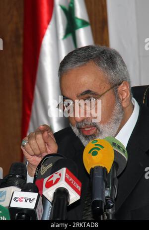 Syrian Information Minister Omran al-Zoubi speaks to the press before a ...