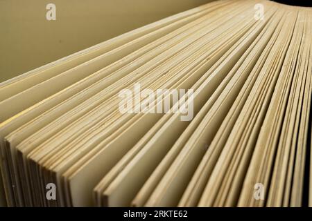 Micro of book pages and copy space on grey background Stock Photo - Alamy