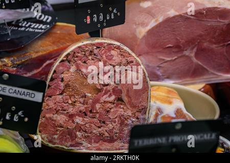 French butcher shop counter with head cheese for sale at a farmers ...