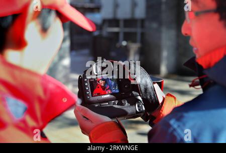 A 14 year old panda named YeYe holds her young cub at Wolong Giant ...