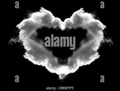 Heart shaped cloud with wings isolated over black background Stock ...
