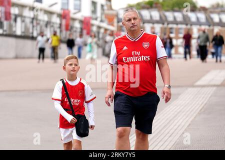 Arsenal fans make their way to the stadium ahead of the Premier League ...