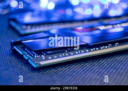 Memory module DDR4 DRAM macro in blue light. Computer RAM chipset close-up. Desktop PC hardware ...