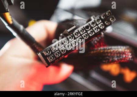 Cable connector (24 pin) from power supply of desktop PC close-up with ...