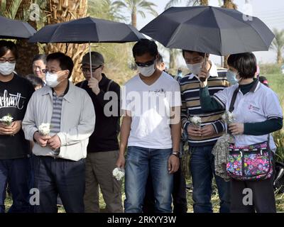 Relatives of nine victims killed in a bank robbery mourn outside the ...