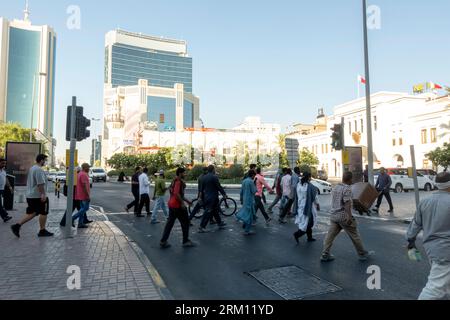 People crossing street in Manama Bahrain, pedestrians cross street in ...