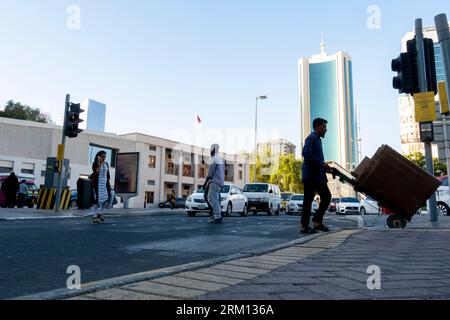 People crossing street in Manama Bahrain, pedestrians cross street in ...
