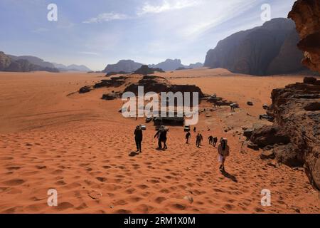 Tourists at Al Ramal Red Sand Dune, Wadi Rum, Unesco World Heritage ...