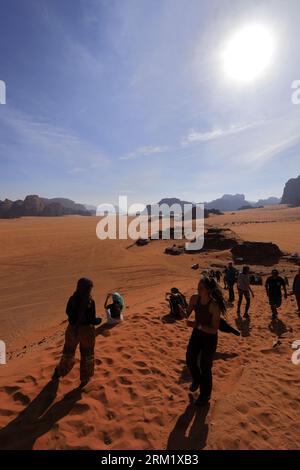 Tourists at Al Ramal Red Sand Dune, Wadi Rum, Unesco World Heritage ...