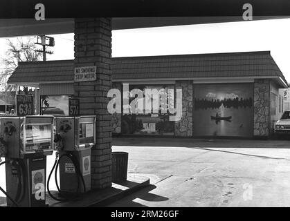 Gas Station, 1970s, with gas pumps and cigarette advertising Stock ...