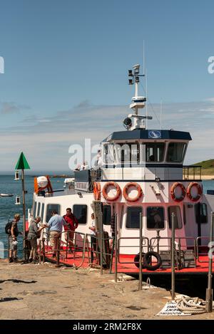 Passengers embarking onto the passenger ferry across the Kyle of ...